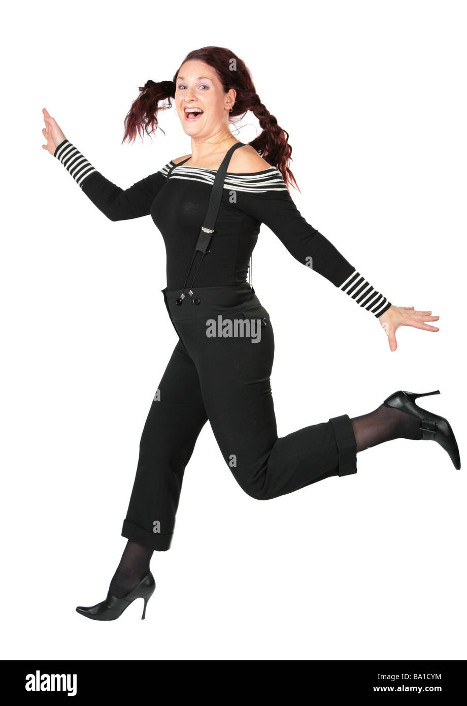 Beauty woman with tails in black runs Stock Photo - Alamy