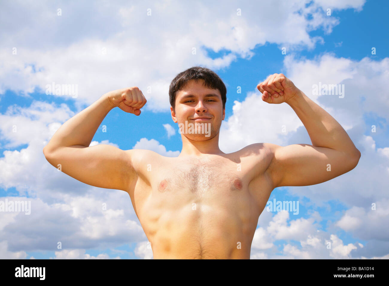 Bodybuilder on sky background Stock Photo - Alamy