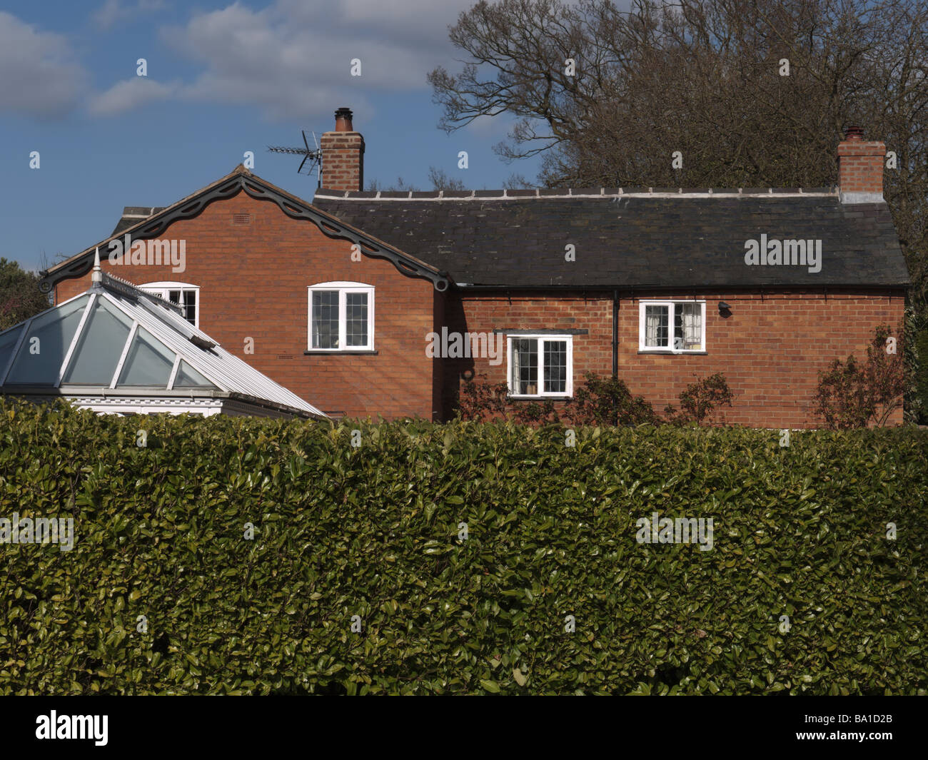 a country house behind a hedge Stock Photo - Alamy
