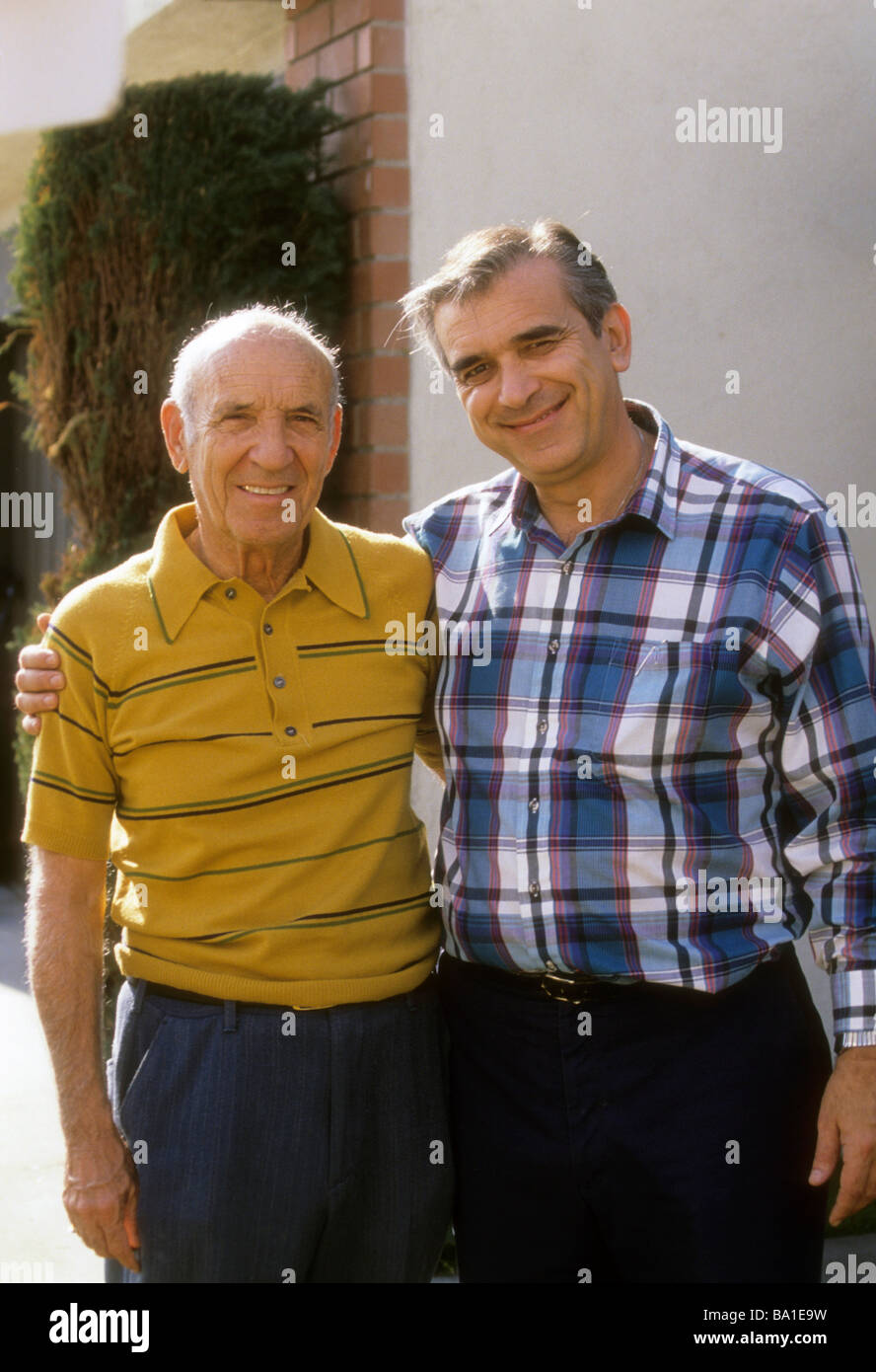 Man and father hug smile love son dad man men child outdoor sun outside ...