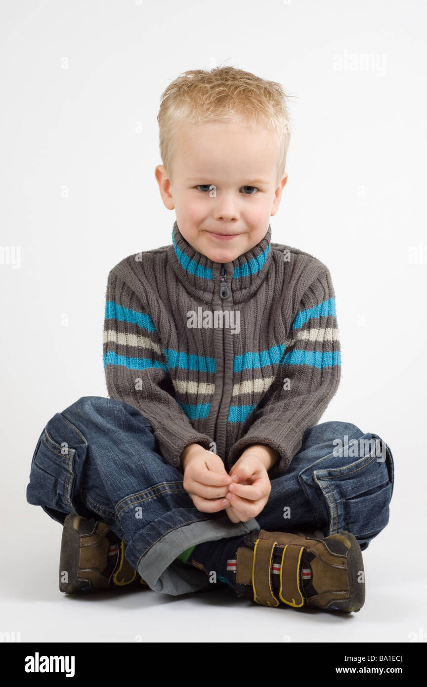 Cute Crosslegged Boy Stock Photo - Alamy
