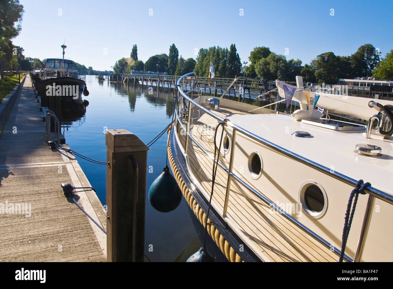 Boat moored alongside Thames towpath near Teddington Lock, adjacent to ...