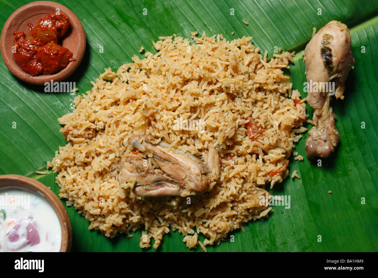 Kerala Style Biryani is a rice dish made with fried chicken/mutton and ...