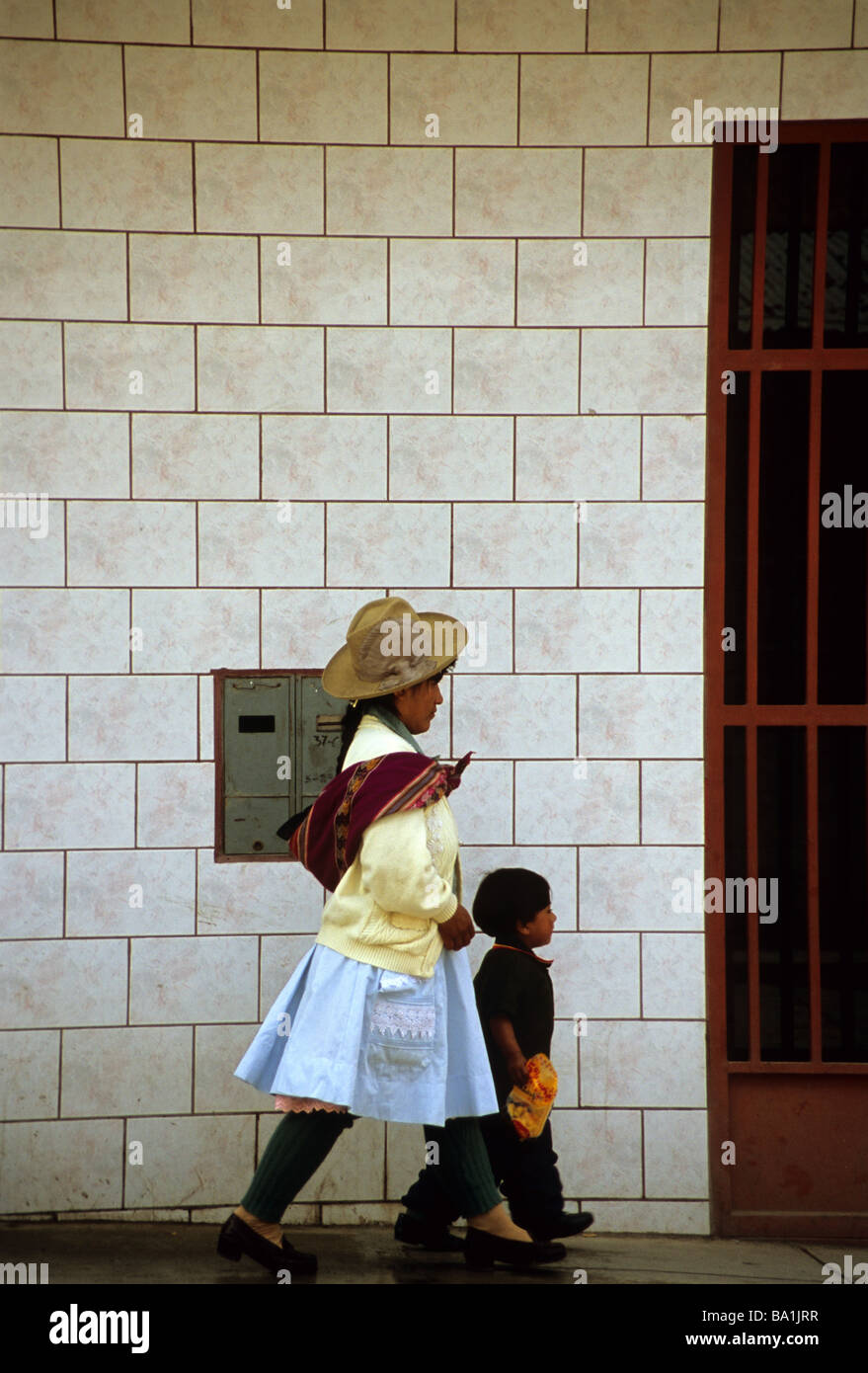 a peruvian woman and son walk on a street in huaraz,peru Stock Photo ...