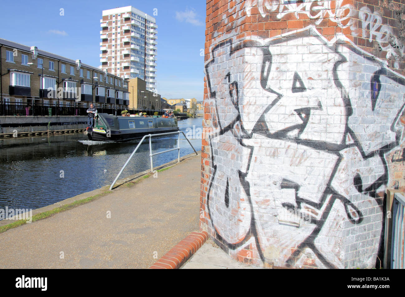 barge on urban canal graffiti in foreground Stock Photo - Alamy