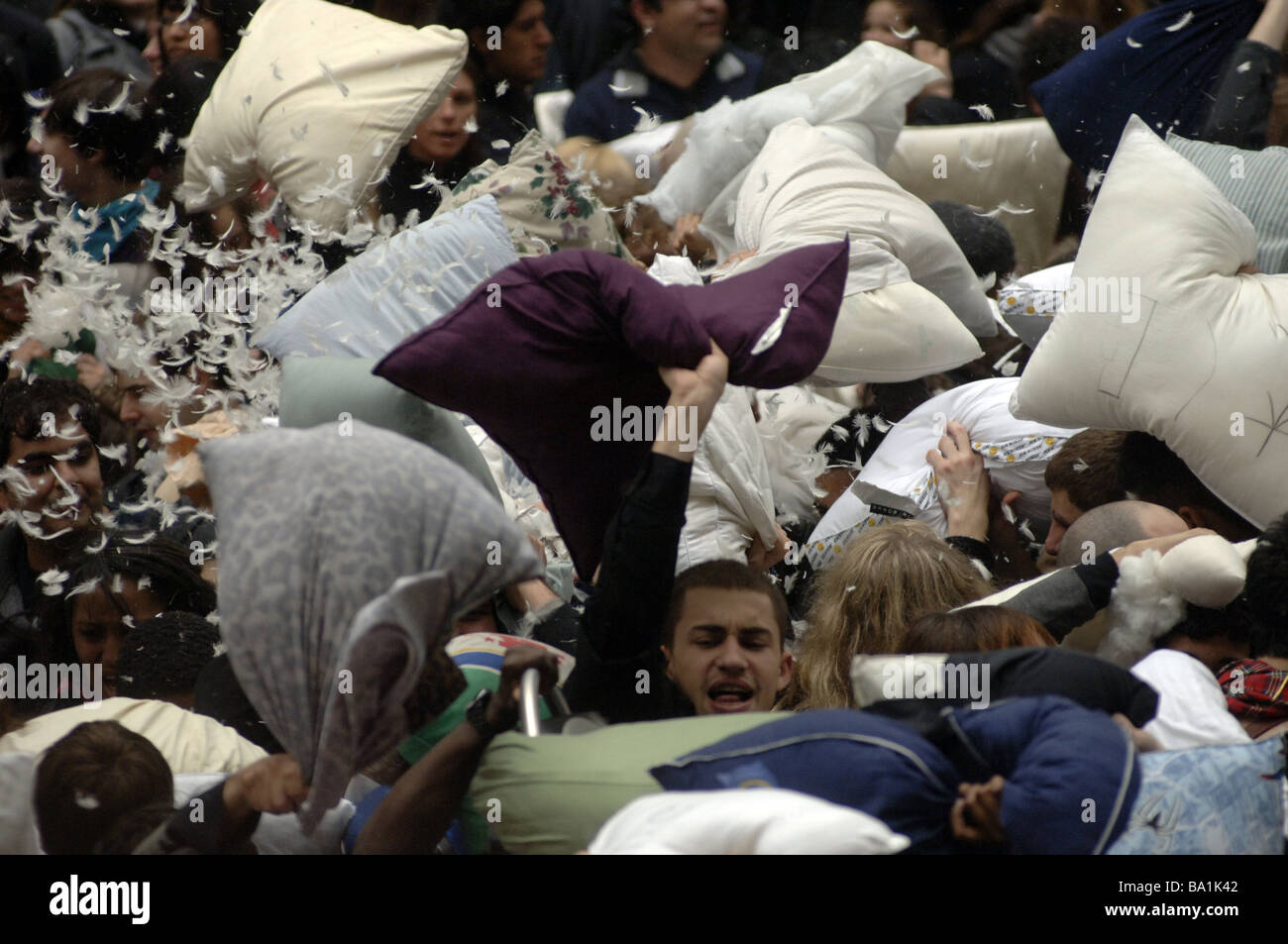 Hundreds of like minded pillow fighters take out their aggression on ...