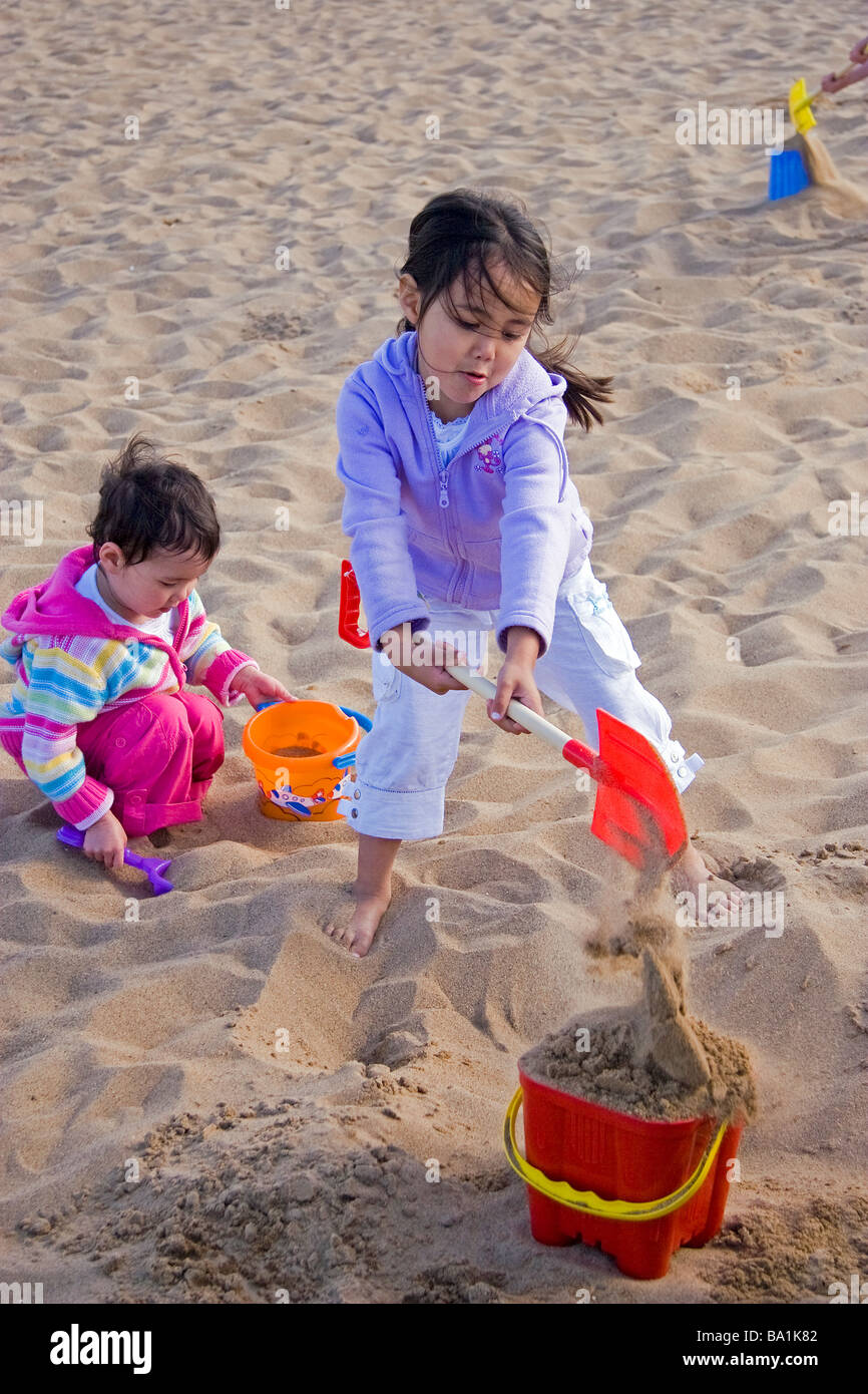 Child Filling Bucket High Resolution Stock Photography and Images - Alamy