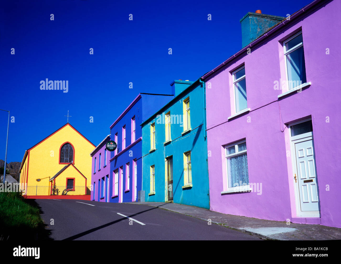 Wonderful sunny day with colourful houses and church in Eyeries ...