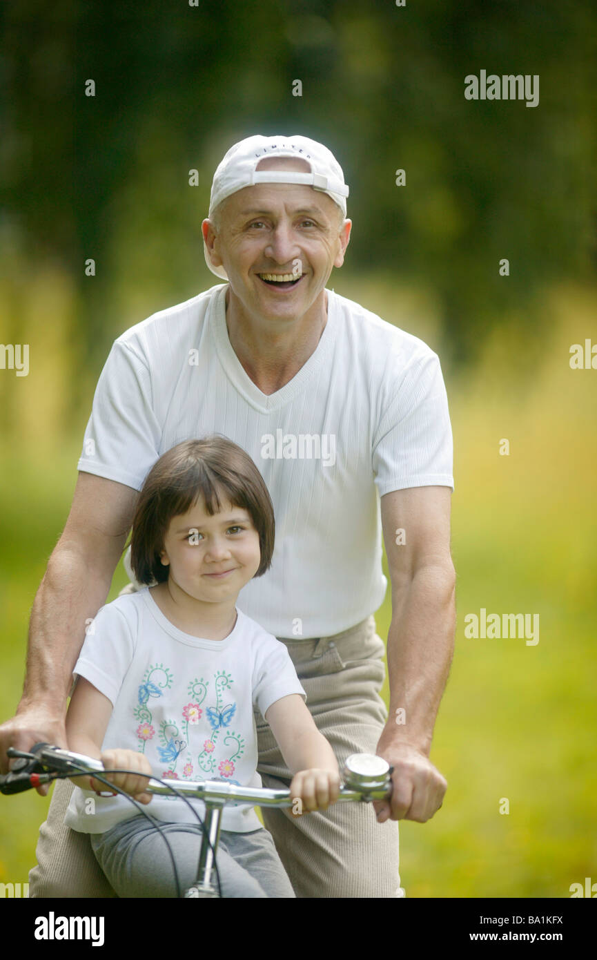 Man girl riding tandem bicycle hi-res stock photography and images - Alamy