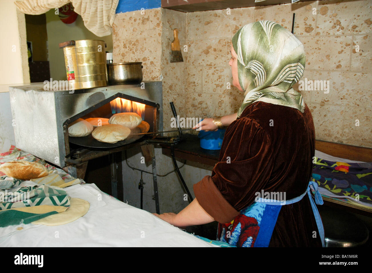 Middle eastern woman baking hi-res stock photography and images - Alamy