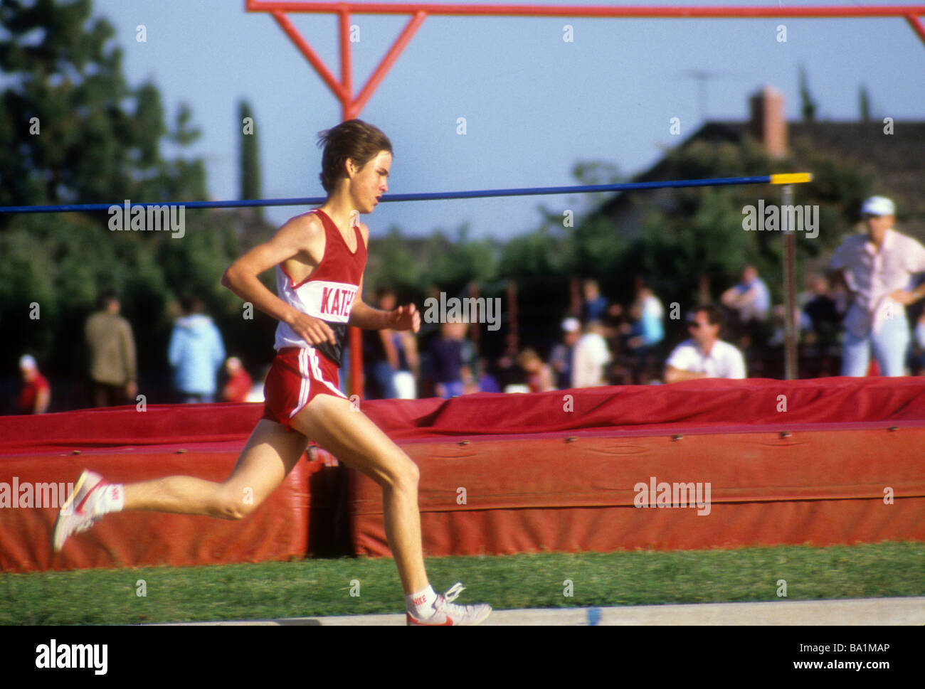 track meet teen boy run uniform race stride Stock Photo - Alamy