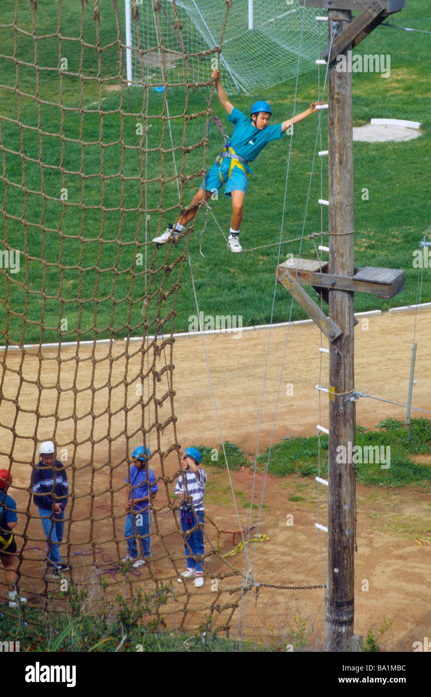 Boy climb trust danger faith high tall risk support safe safety rope ...