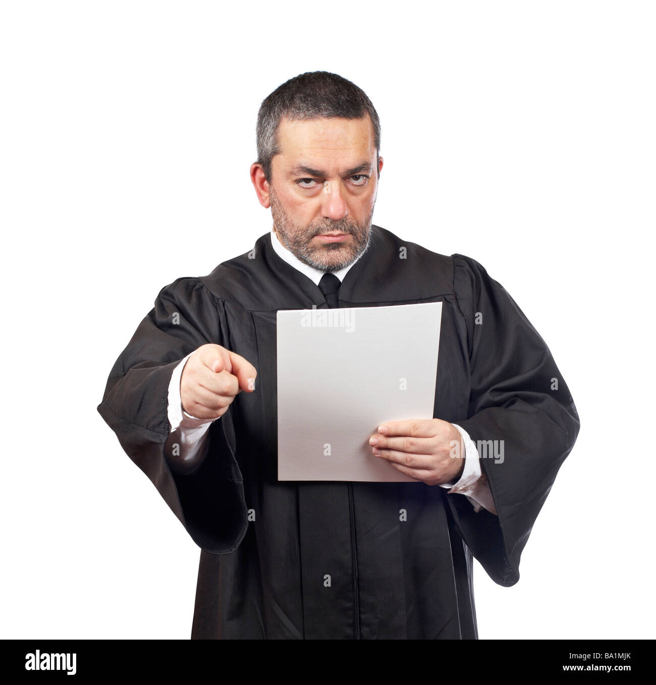 Serious male judge reading the sentence isolated on white background ...