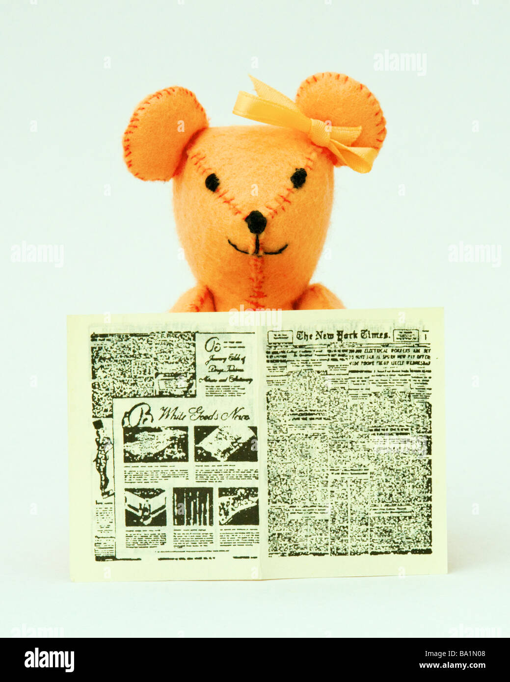 Miniature teddy reading the news (Mini Bear Collection Stock Photo - Alamy
