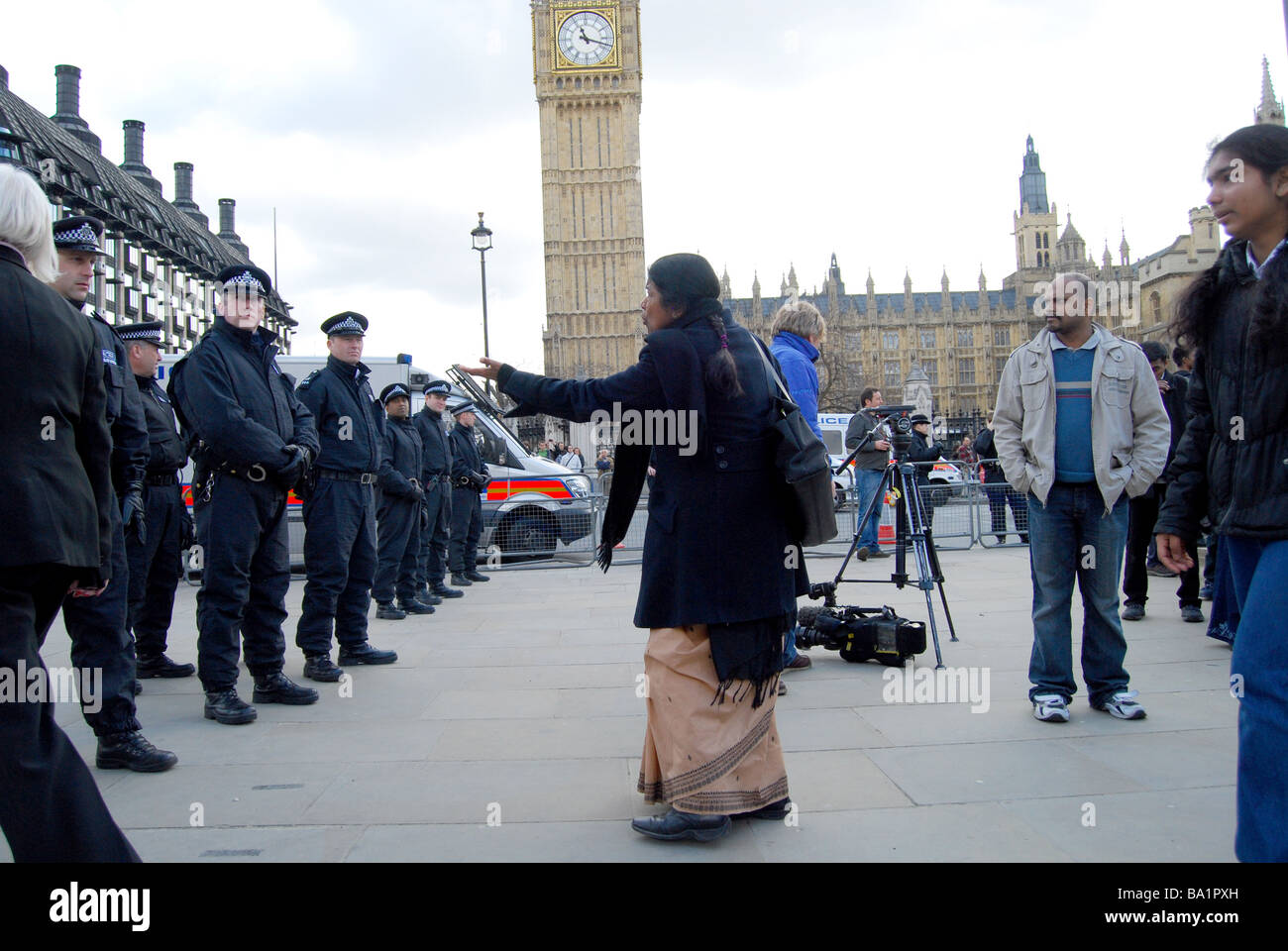 Confrontation police policemen heckler shout shouting emotion baton ...