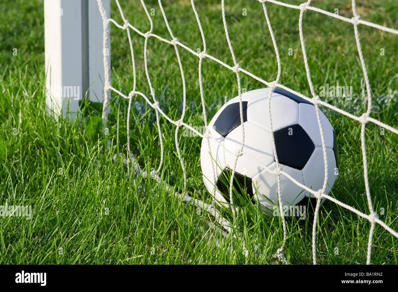 Soccer ball into net hi-res stock photography and images - Alamy
