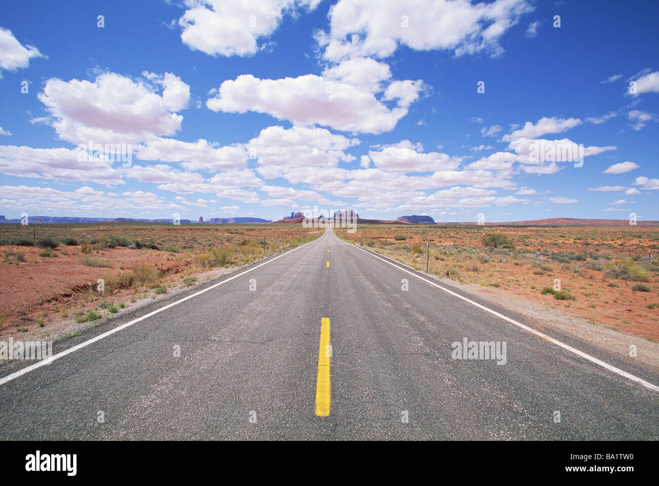 Empty Straight Road against Blue Sky Stock Photo - Alamy