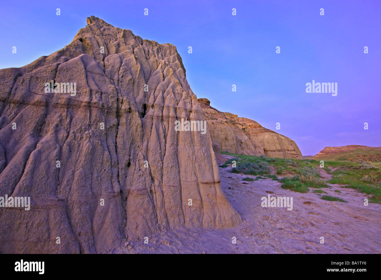 Formations of Castle Butte during dusk in Big Muddy Badlands Southern ...