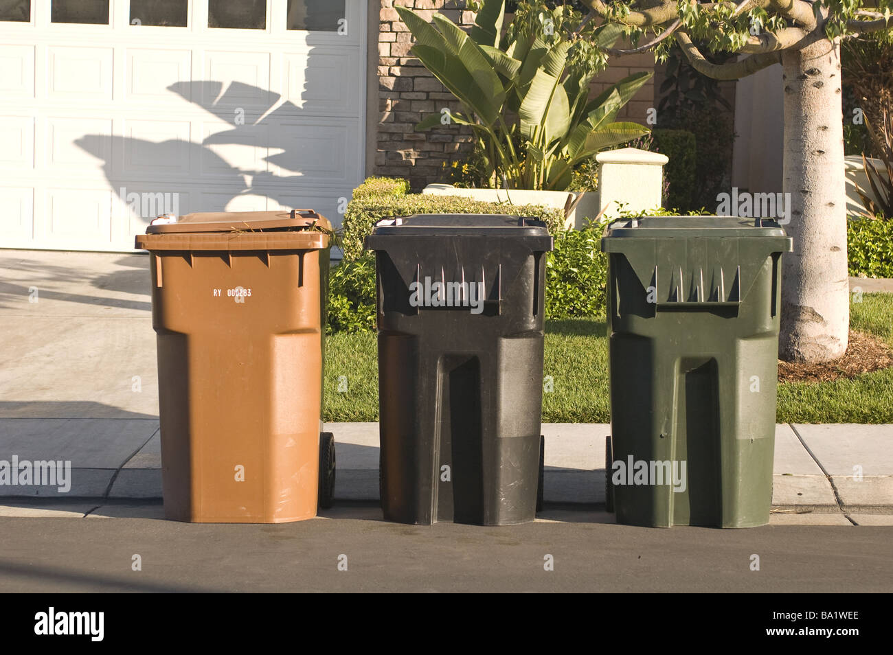 Three containers used for different recyclables Stock Photo - Alamy