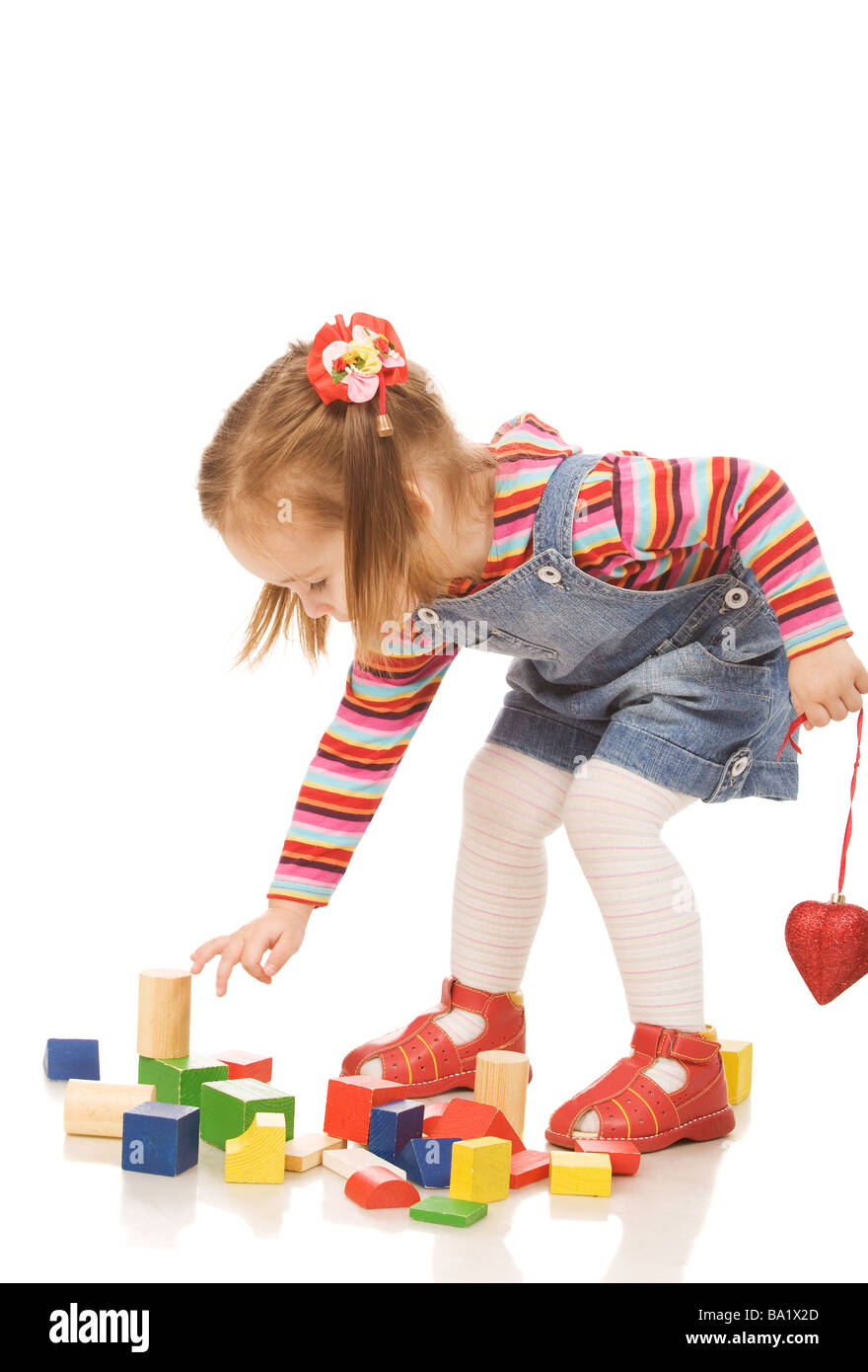 little girl play with bricks Stock Photo - Alamy