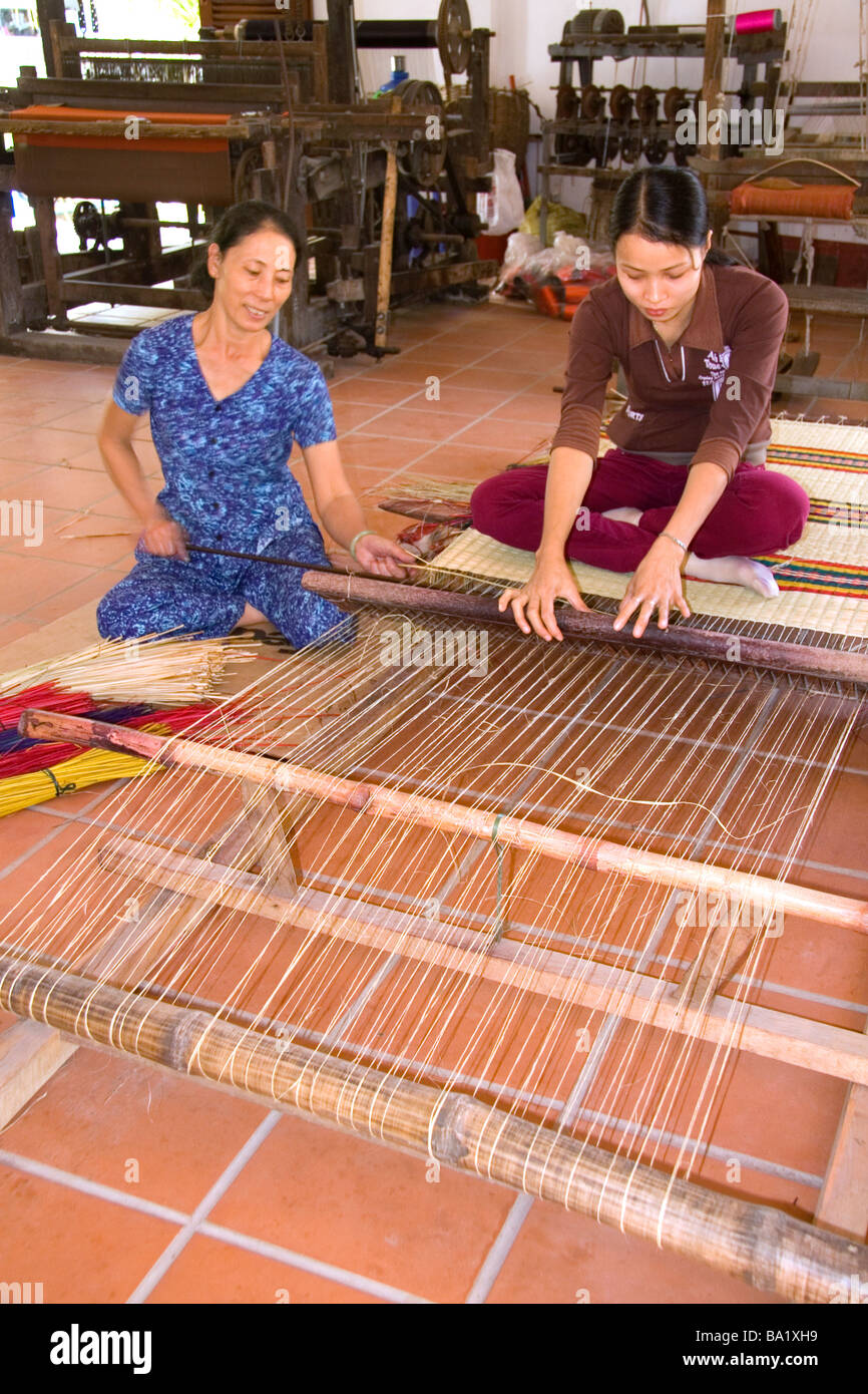 Vietnamese women weaving mats at a craft factory in Hoi An Vietnam ...