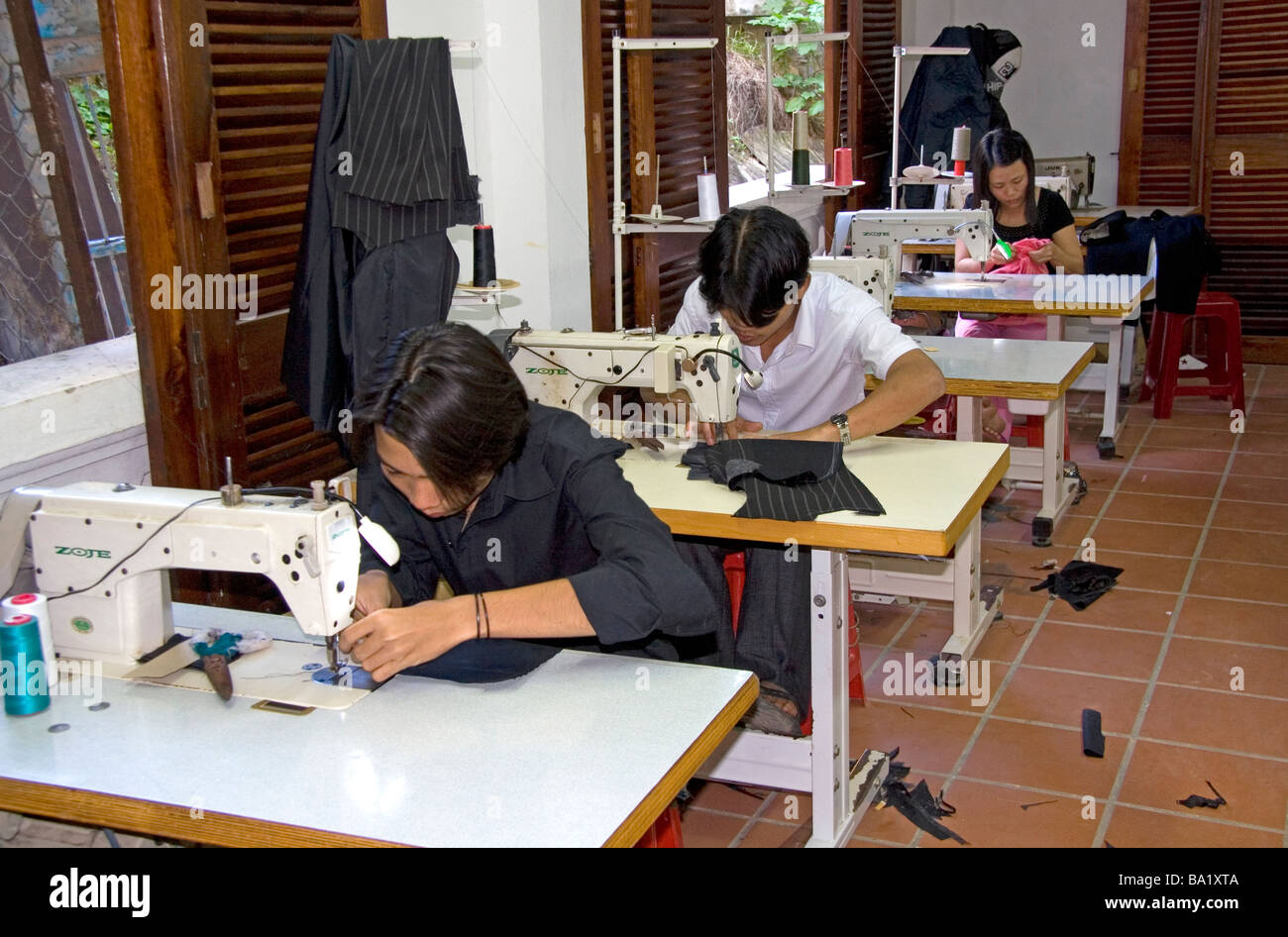 Workers sewing at the Yaly clothing factory in Hoi An Vietnam Stock ...
