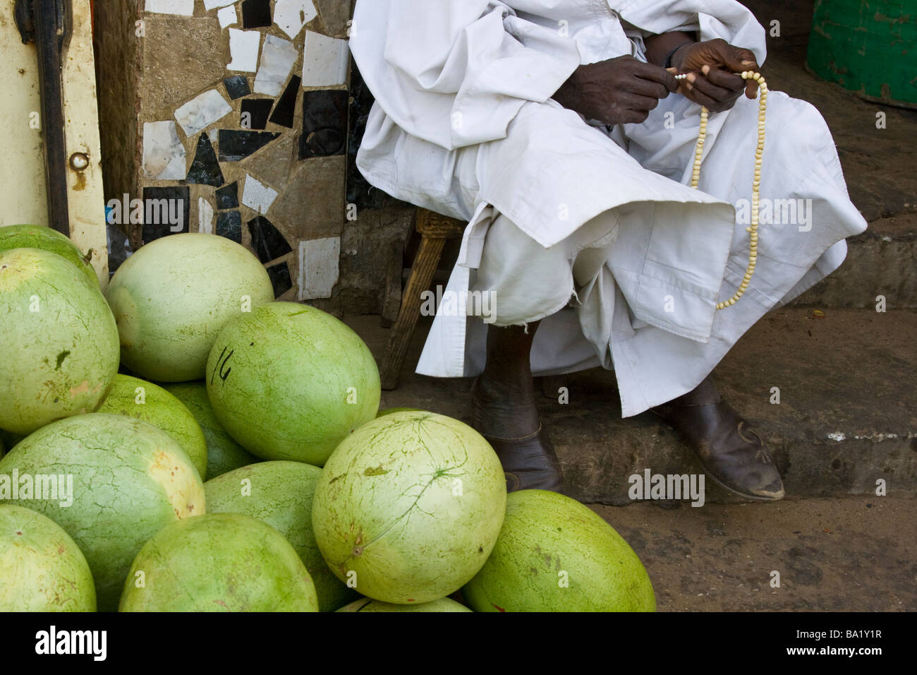 Muslim Man Counting Prayer Beads and Selling Watermelons in Dakar ...