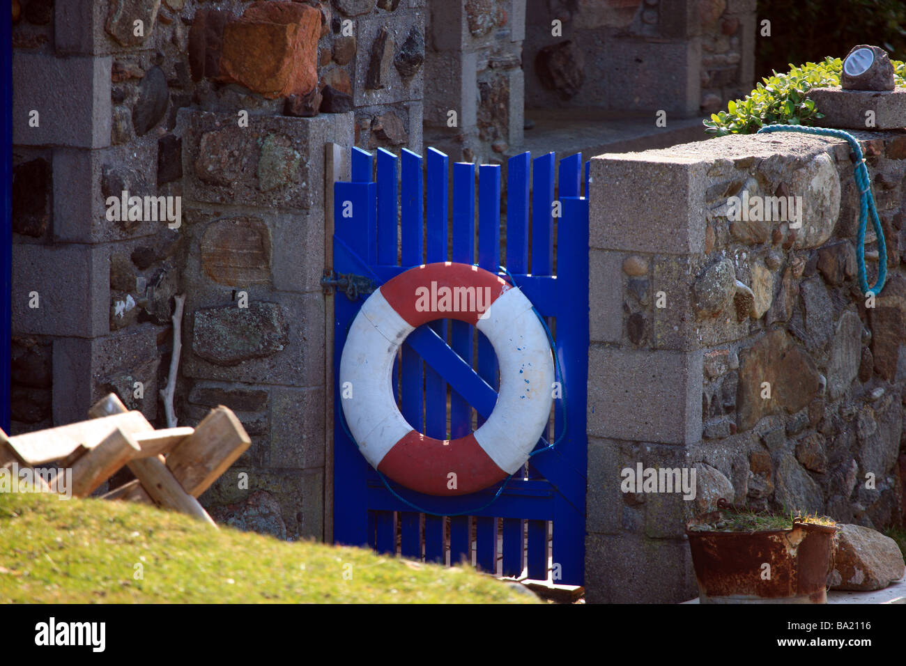 Blue garden gate with Lifebuoy Stock Photo - Alamy