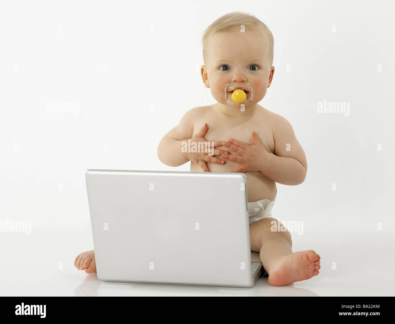 Baby pacifiers diaper laptop 1 years toddler girls bare floor sits gaze ...