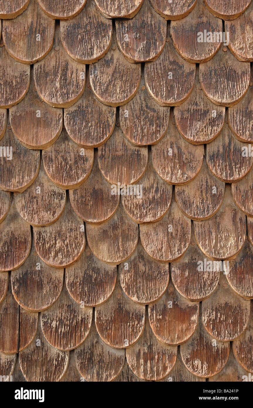 Wooden tiles on the wall of a mountain chalet in the Alpine village of ...