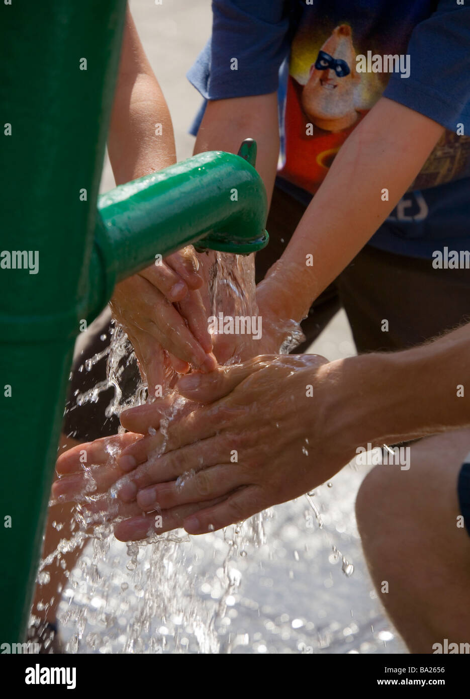 Children play well water hi-res stock photography and images - Alamy
