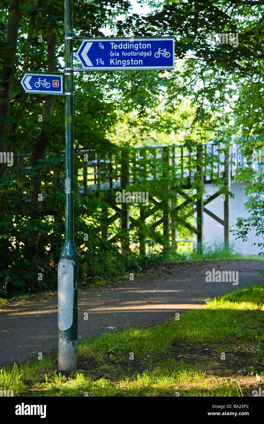 Signpost featuring the Thames Cycle Path at Teddington Lock showing a ...