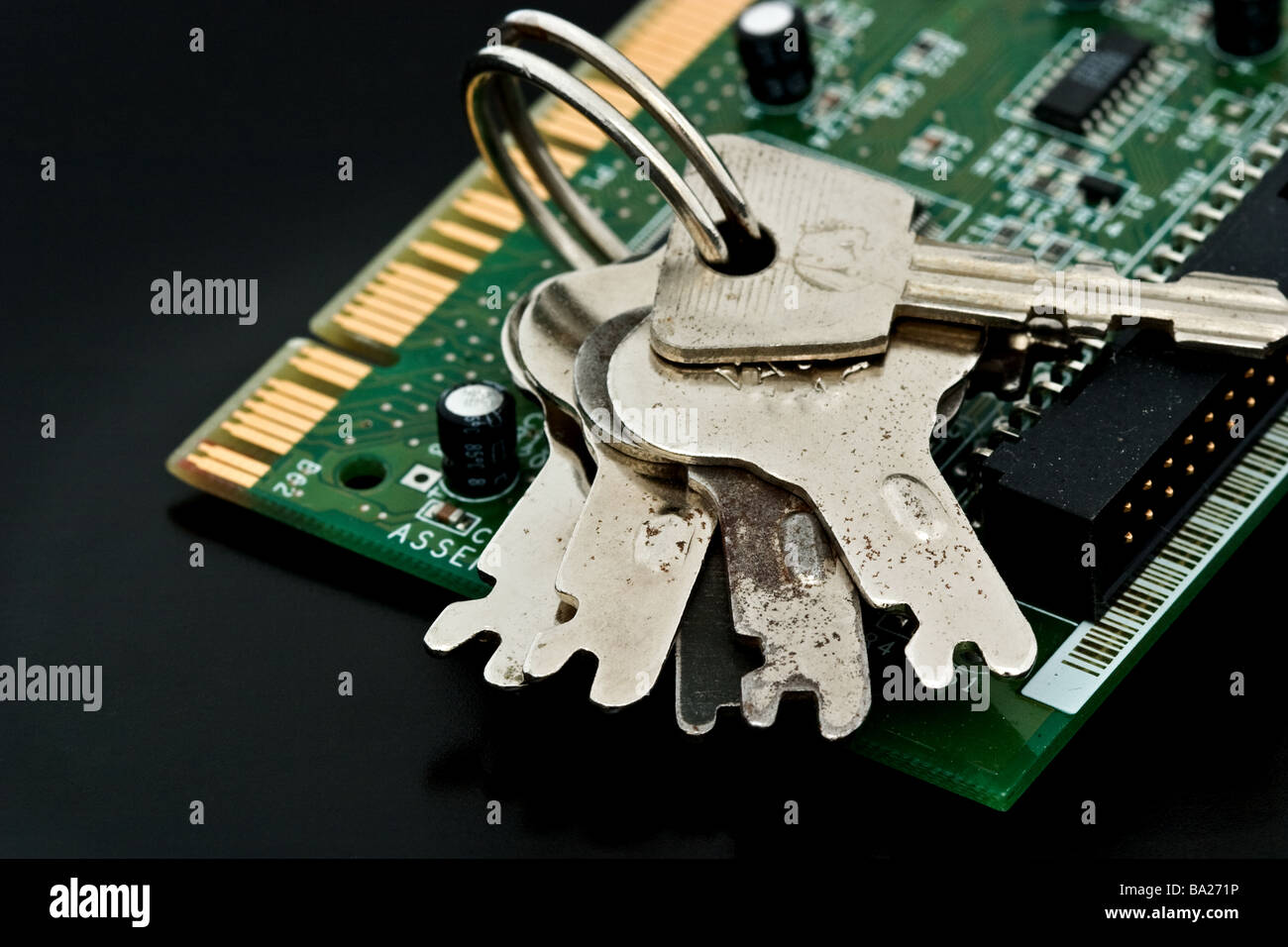 Keys on a circuit board with a gold connector strip Stock Photo - Alamy