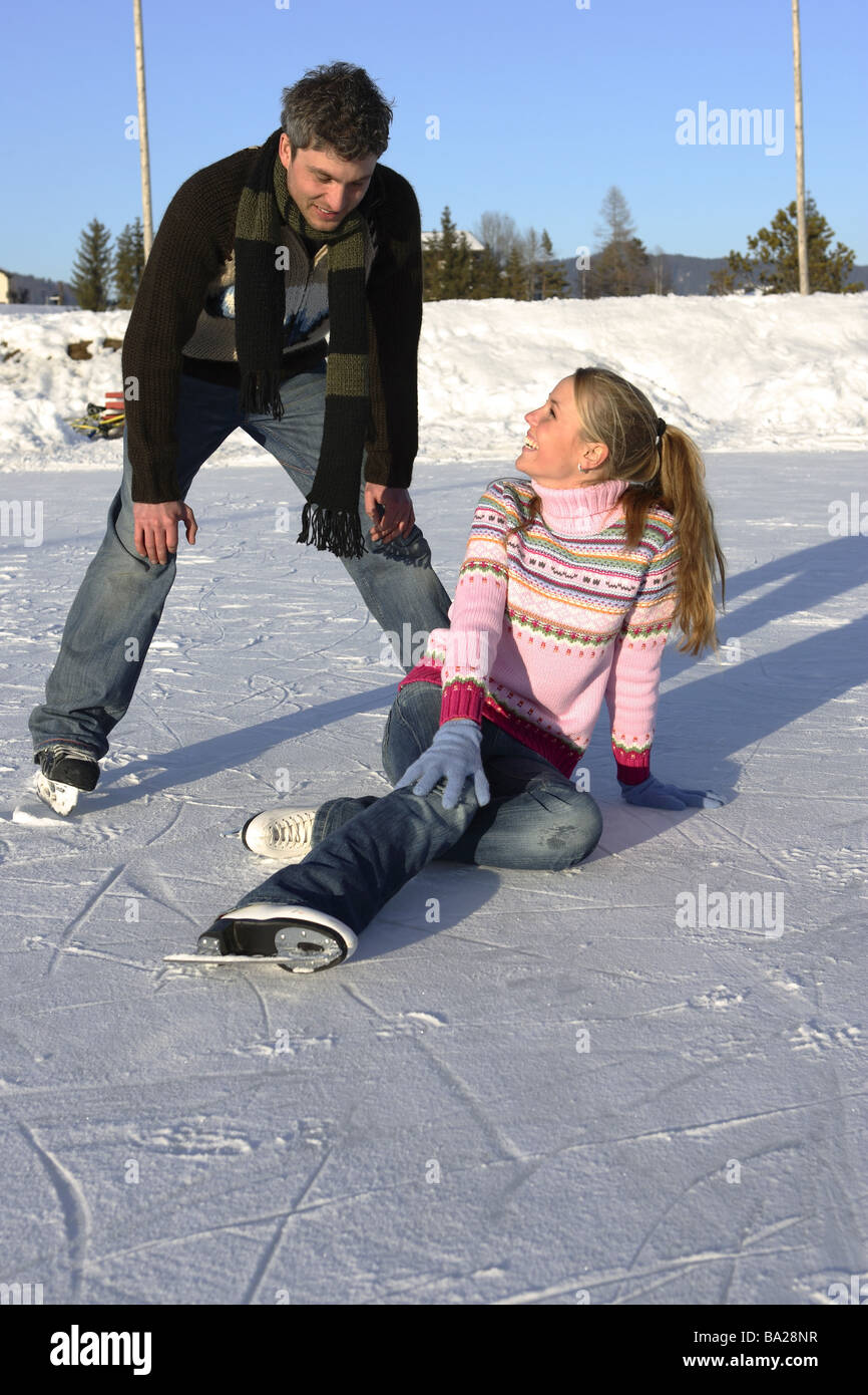 Couple falling ice skating hi-res stock photography and images - Alamy