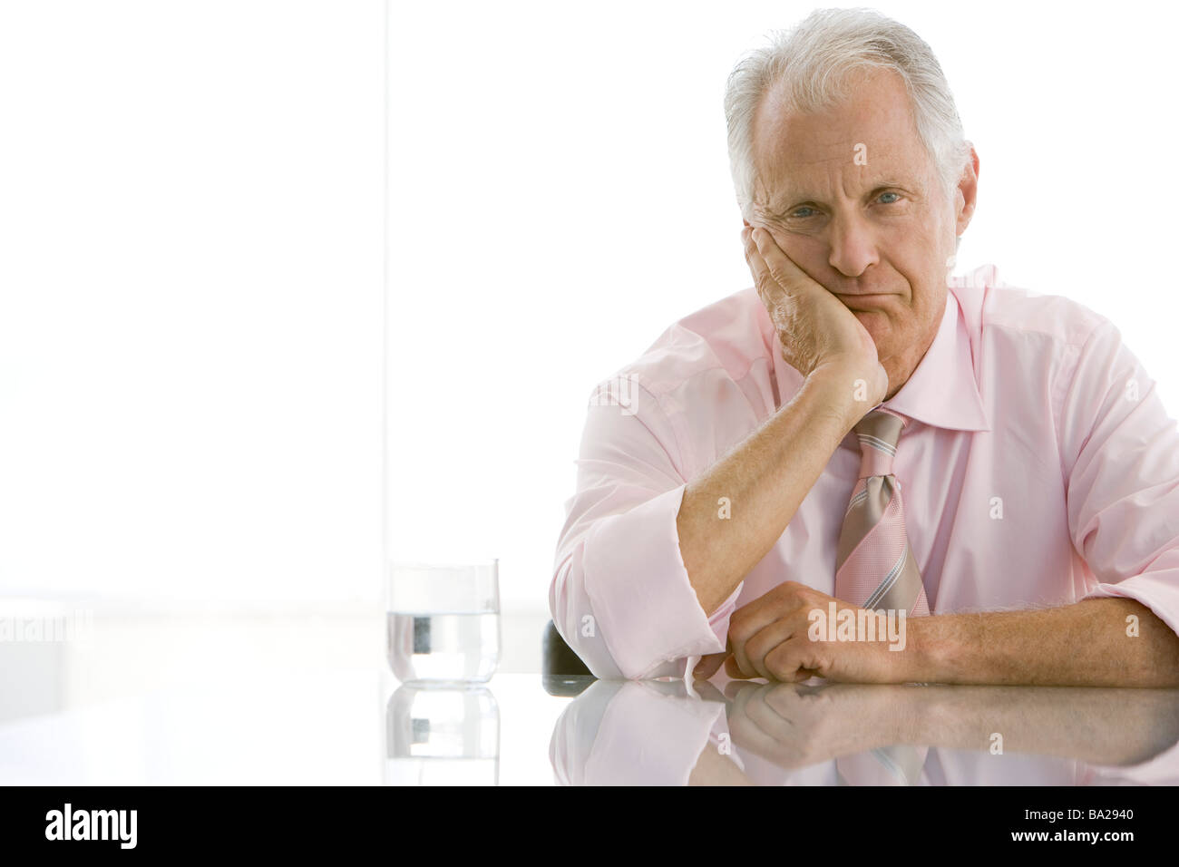 Bored business man in conference room Stock Photo - Alamy