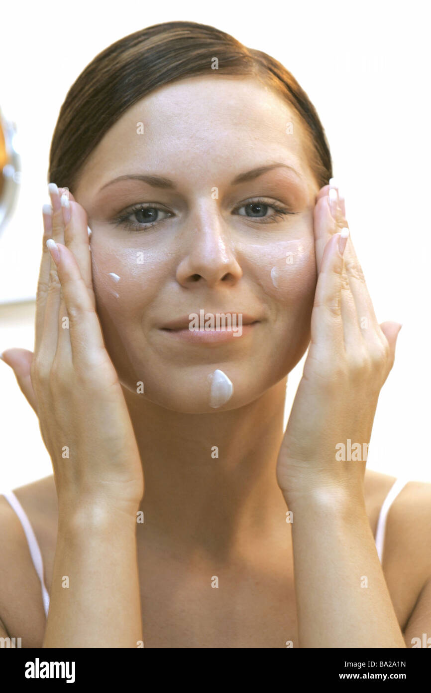 Woman creaming her face hi-res stock photography and images - Alamy