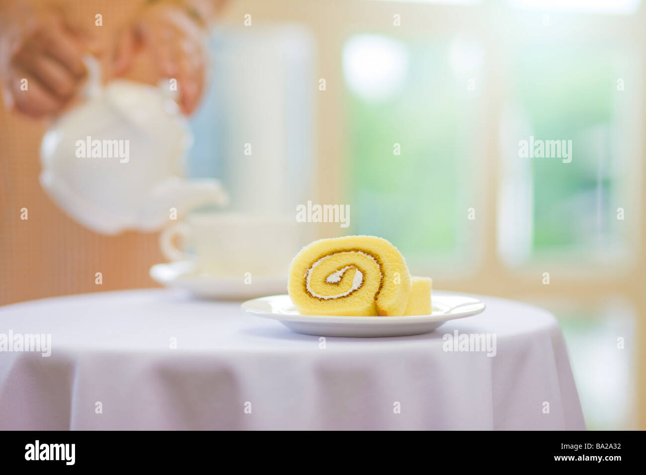 Person Serving Tea with Snacks Stock Photo - Alamy