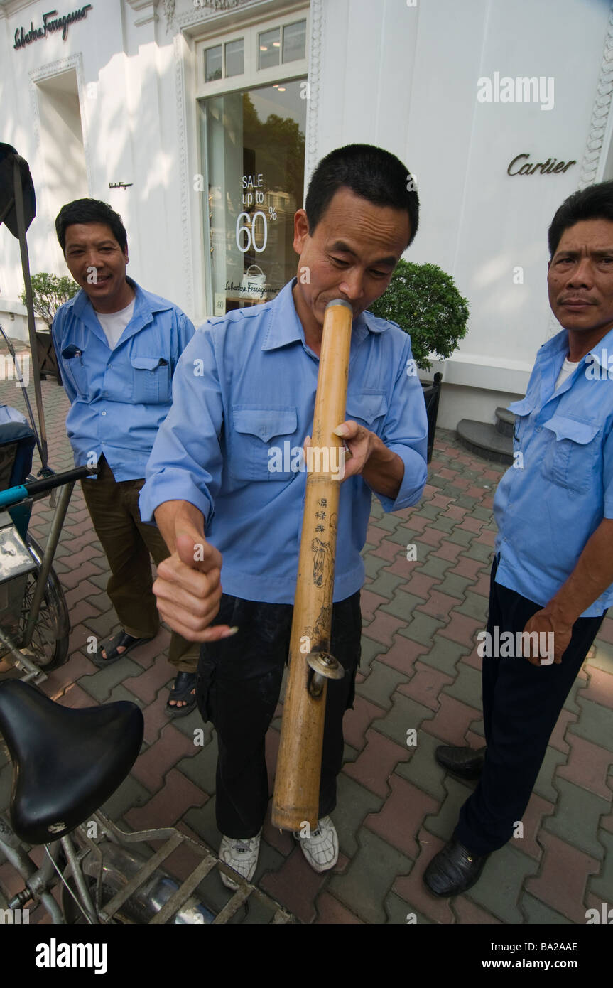 cyclo drivers taking bong hits on their break in Hanoi Vietnam Stock ...