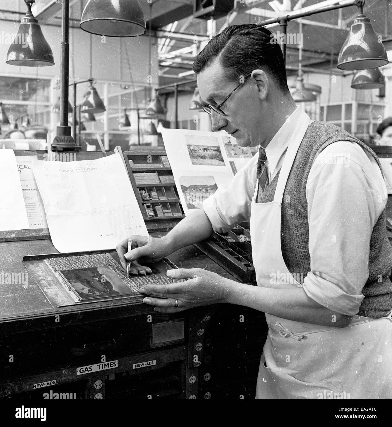 Traditional typesetter at work at the HWV printing works, Aylesbury ...