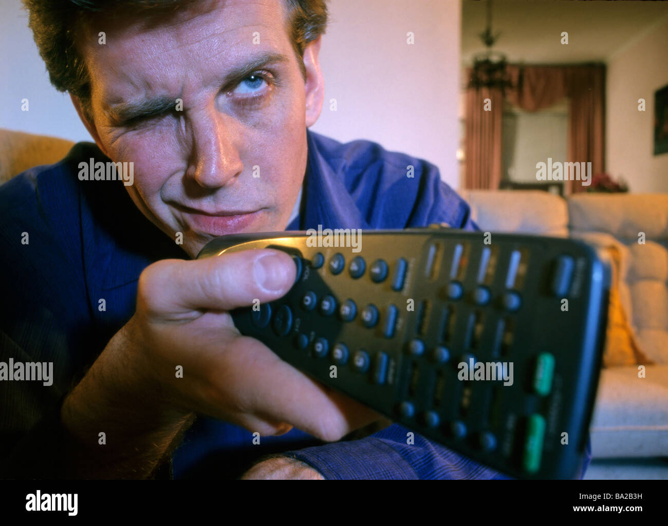 Man watches TV Stock Photo - Alamy
