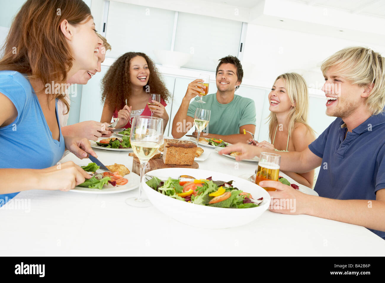 Friends Having Lunch Together At Home Stock Photo - Alamy