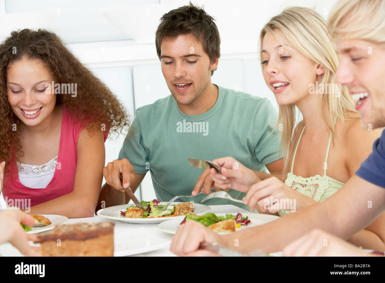 Friends Having Lunch Together At Home Stock Photo - Alamy