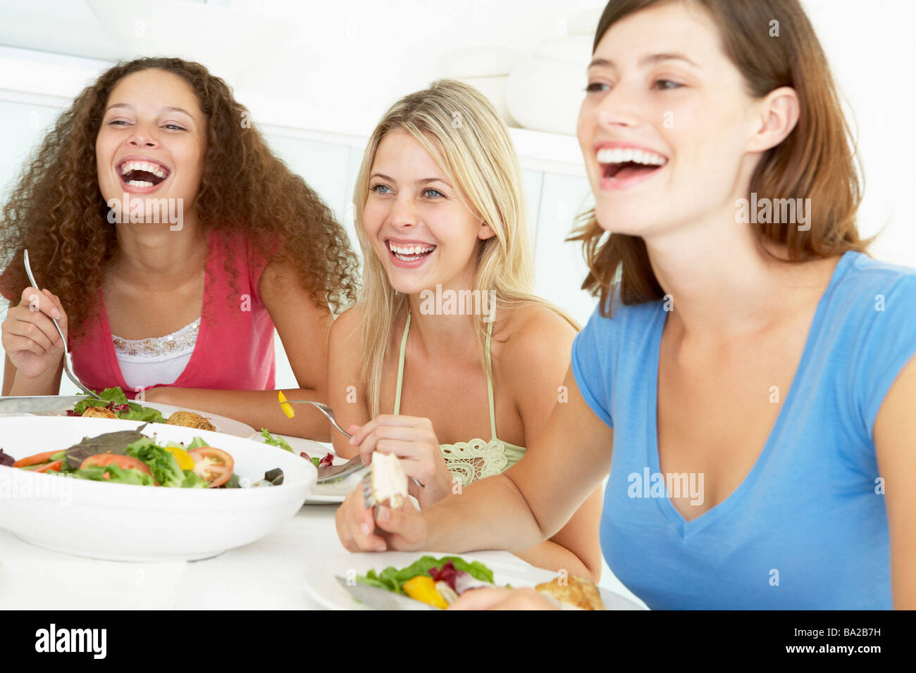 Friends Having Lunch Together At Home Stock Photo - Alamy