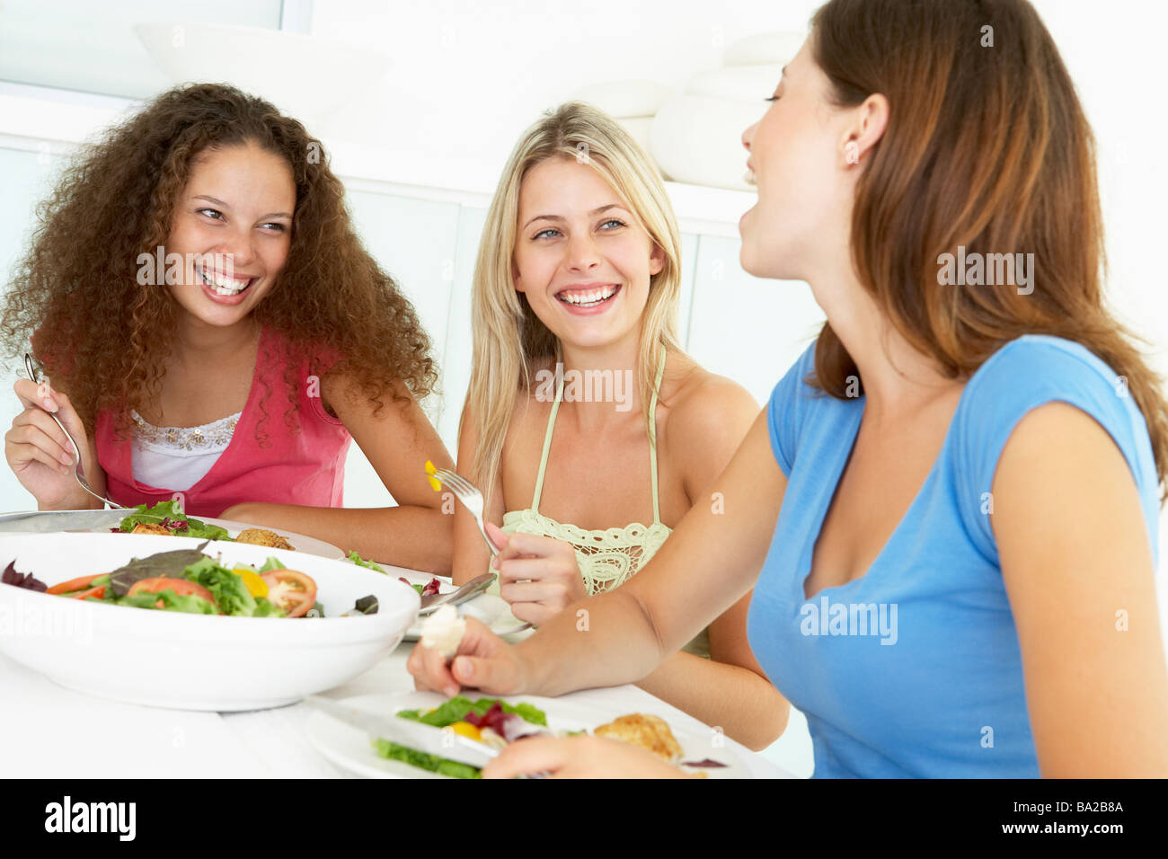 Friends Having Lunch Together At Home Stock Photo - Alamy