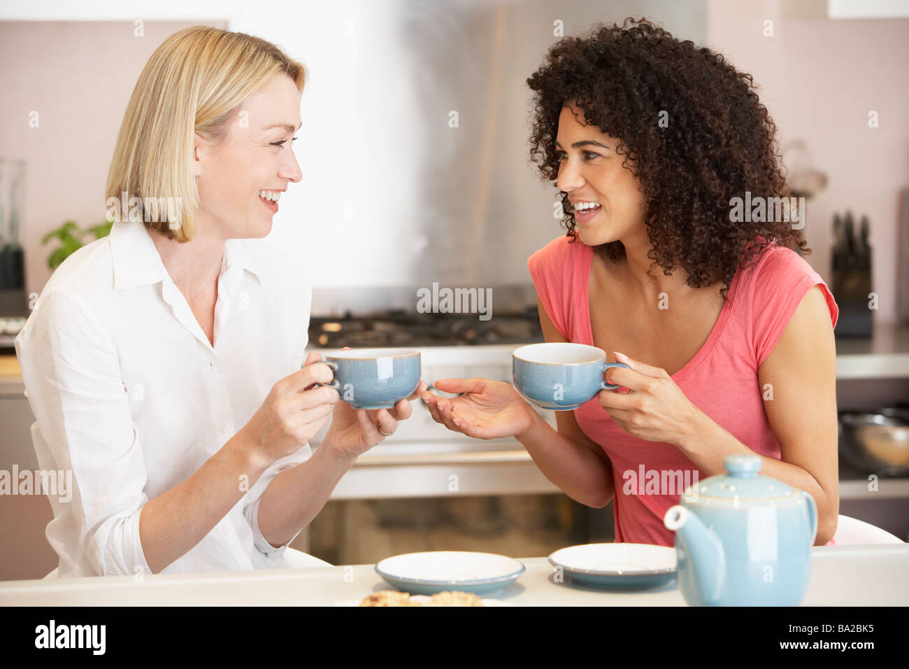 Female friends enjoying tea cookies hi-res stock photography and images ...