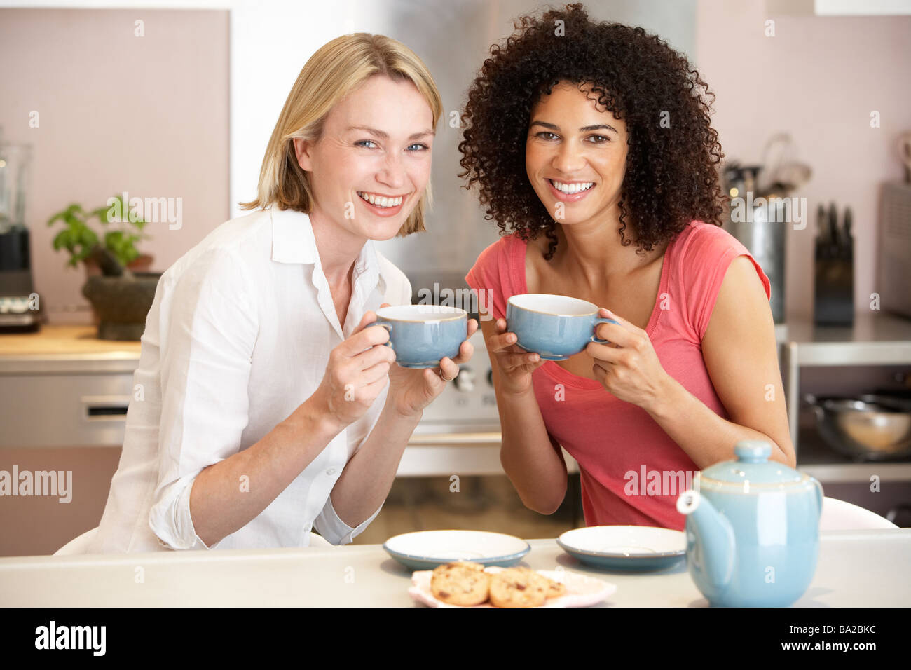 Female friends enjoying tea cookies hi-res stock photography and images ...