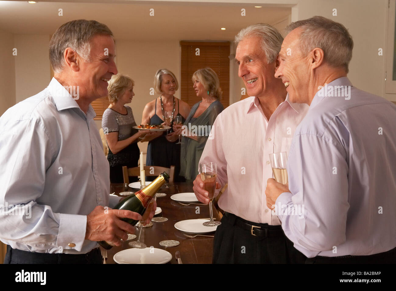 Entertaining guests dinner party hi-res stock photography and images ...
