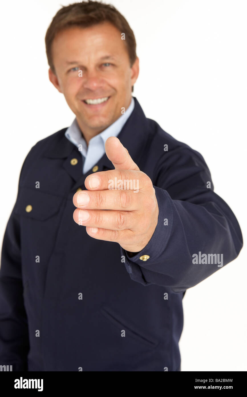 Courier Extending His Hand For A Handshake, Smiling At The Camera Stock ...