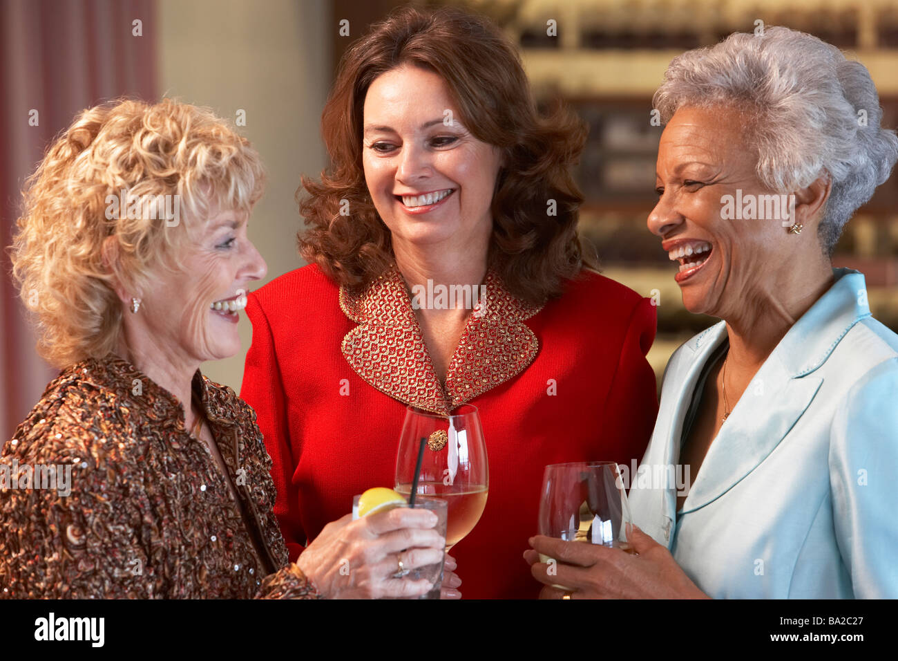 Friends Socializing At A Bar Stock Photo - Alamy