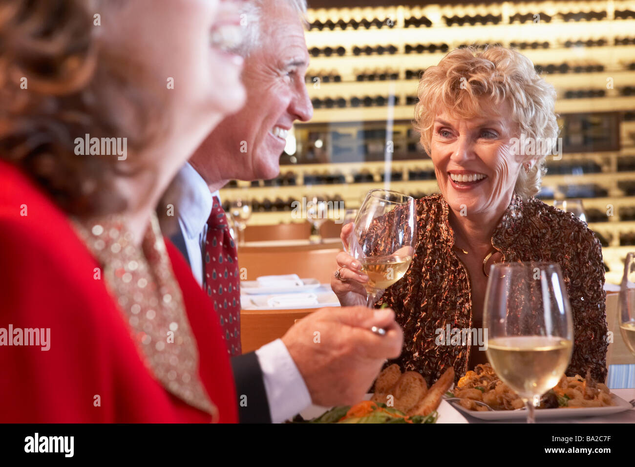 Friends Having Dinner Together At A Restaurant Stock Photo - Alamy